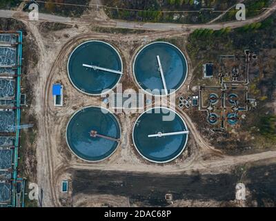 Modern sewage treatment plant, view over a primary clarifier and ...