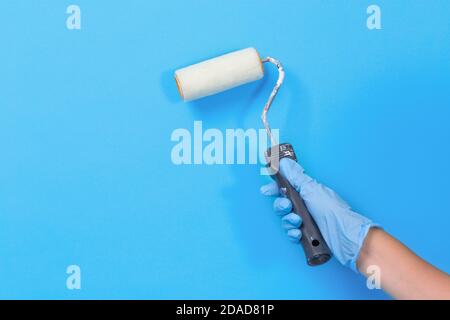 Hands of worker painting wall in room Stock Photo - Alamy