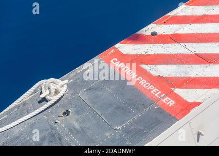 Warning sign on an aircraft engine about the hazardous areas around a ...