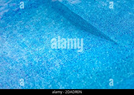 Edge of the swimming pools with turquoise azure and blue water color ...