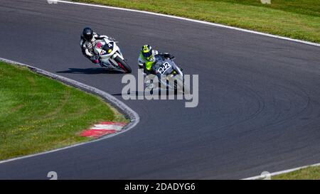 A shot of two racing bikes cornering on a track Stock Photo - Alamy