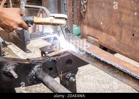 Metal car chassis welding in parts factory Stock Photo - Alamy