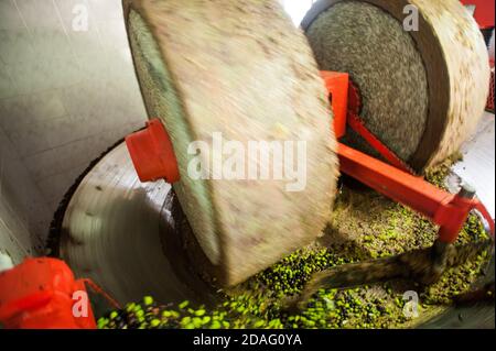 Grinding stone in olive oil factory Stock Photo - Alamy