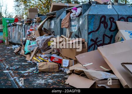 Overfilled waste paper containers, despite overcrowding, people put ...
