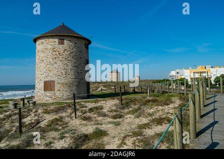 windmill of Apúlia side by side with the beach in north Portugal. North ...