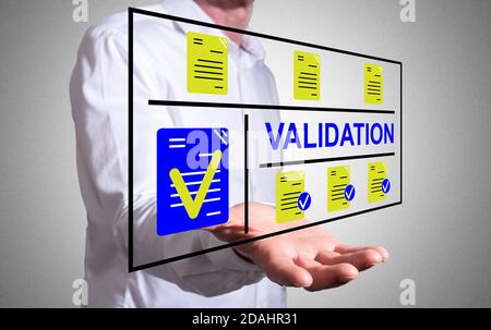Validation concept levitating above a human hand Stock Photo - Alamy