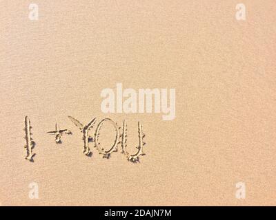 I plus you, the inscription on the sand, I and you Stock Photo - Alamy