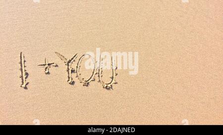 I plus you, the inscription on the sand, I and you Stock Photo - Alamy