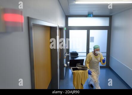 13 November 2020, Saxony, Dresden: A cardboard ambulance sticks to a ...