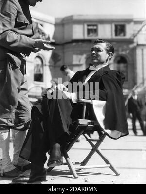 CLARK GABLE on set candid with Set Visitor ROBERT CANAVAN (his roommate ...
