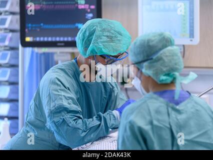 13 November 2020, Saxony, Dresden: A cardboard ambulance sticks to a ...