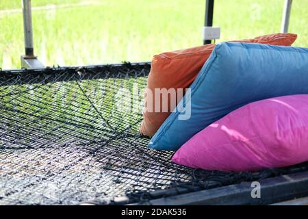 black thread rope net bed pillow for sleeping beside rice paddy field ...
