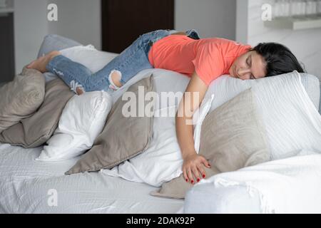 Girl lying in recovery position Stock Photo - Alamy