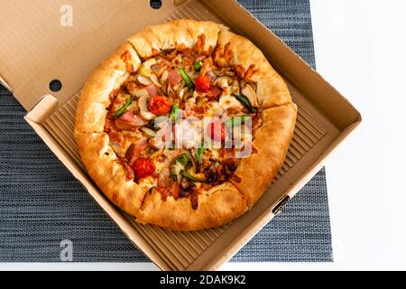 Pizza for one person. Mini pizza in a box. Food delivery Stock Photo ...