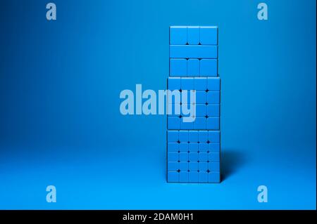 Monochromatic tower of three blue Rubik's Cubes on a Blue Background ...
