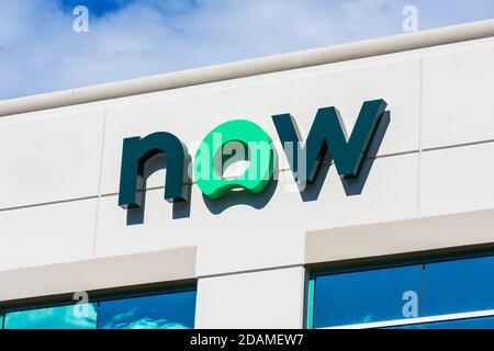 ServiceNow logo atop of American cloud computing company global ...
