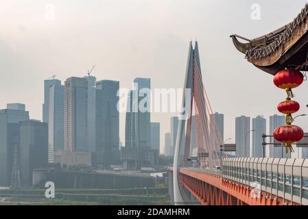 The Qiansimen bridge and the skyline in Chongqing, China, on a cloudy ...
