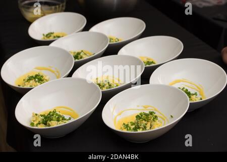 Young irish woman holding bowl with lentils smiling happy and positive ...