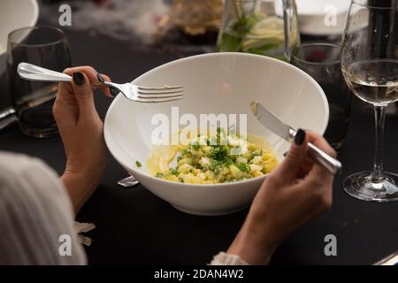 Young irish woman holding bowl with lentils smiling happy and positive ...