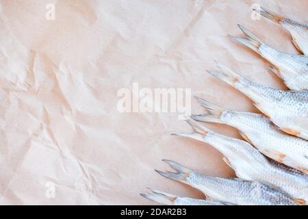 Dried fishes template banner on craft paper background with empty space ...