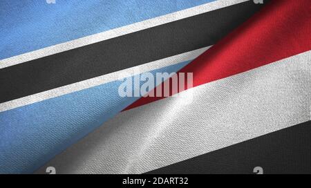 Yemen and Botswana two flags textile cloth, fabric texture Stock Photo ...