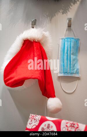 Christmas santa hat on a protective coronavirus face mask Stock Photo ...