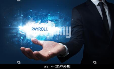 Hand of Businessman holding PAYROLL inscription, successful business ...