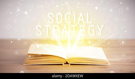 Open book with SOCIAL STRATEGY inscription, social media concept Stock ...