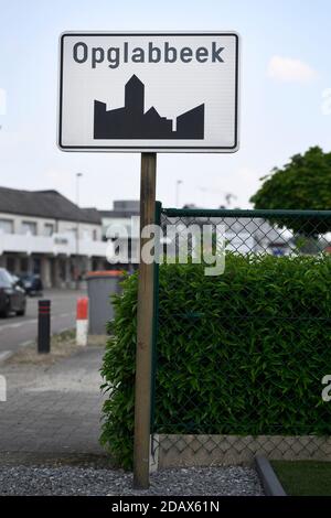 Illustration shows the name of the Opglabbeek municipality on a road ...