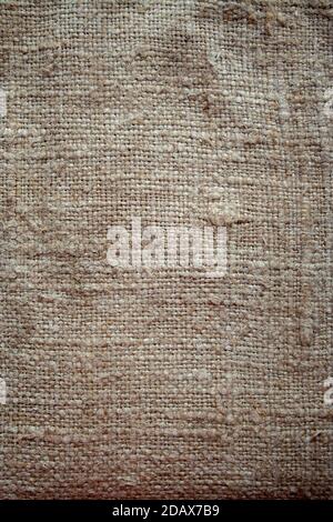 Aged vintage and weathered cloth background texture. Old damaged brown ...