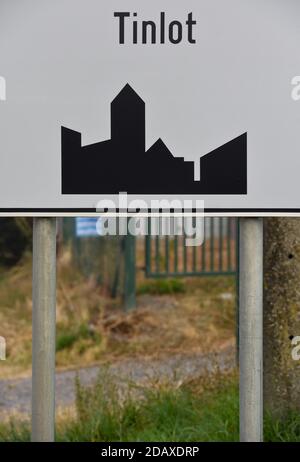 Illustration shows the name of the Tinlot municipality on a road sign ...