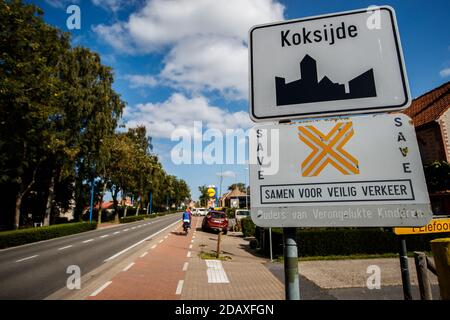 Illustration shows the name of the Koksijde municipality on a road sign ...