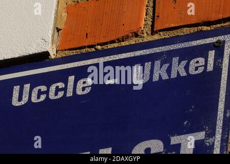 Illustration shows the name of the Uccle Ukkel municipality on a road ...