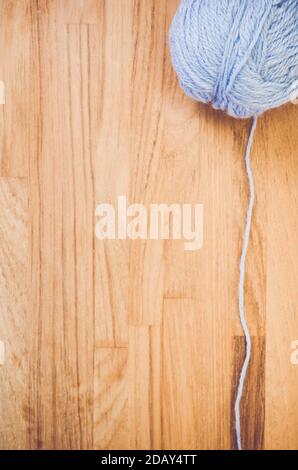 wool ball on a wood tabletop surface Stock Photo - Alamy