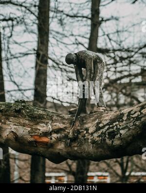 Wooden miniature figure standing on a bridge between two business teams ...