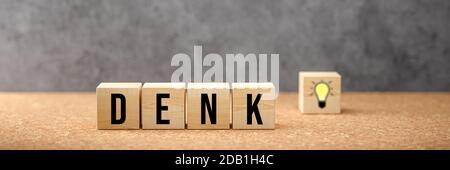 cubes showing message IDEA? and a brainstorming session on concrete ...