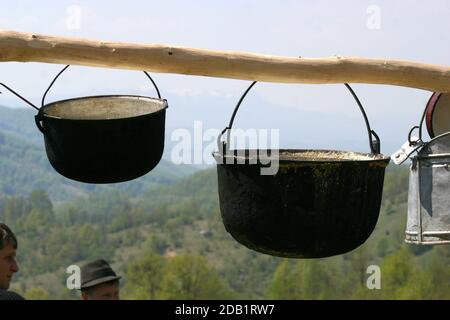 Iron cauldrons for cooking in open fire Stock Photo - Alamy