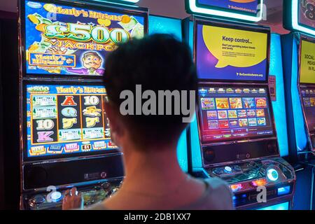 Slot machines / One armed bandits in arcade Stock Photo - Alamy