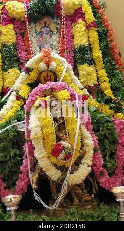 A vertical closeup shot of colorful garland of flowers hanging from ...