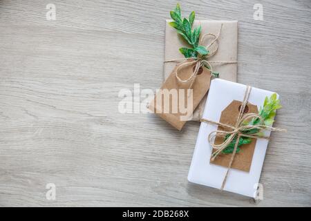 Boxes in craft paper, eco paper on the wooden table Stock Photo - Alamy