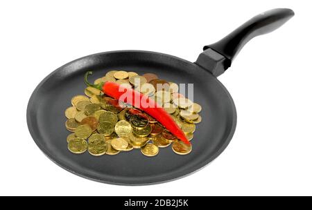 euro coins in a frying pan on gas stove Stock Photo - Alamy