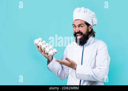 happy guy cook preparing eggs in home kitchen, healthy eating Stock ...