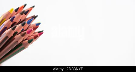 Colored pencils with sharp point that appear from the left side of the ...