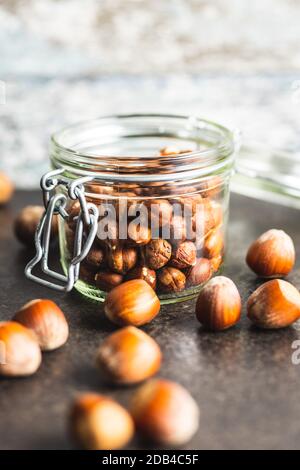 Peeled hazelnuts in jar on kitchen table Stock Photo - Alamy