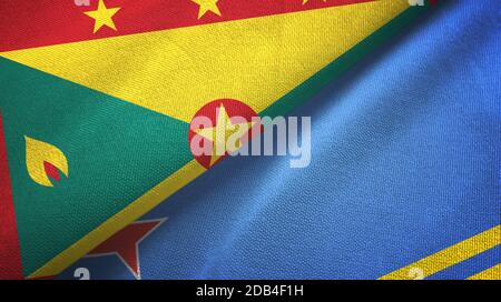 Aruba and Grenada two flags textile cloth, fabric texture Stock Photo ...