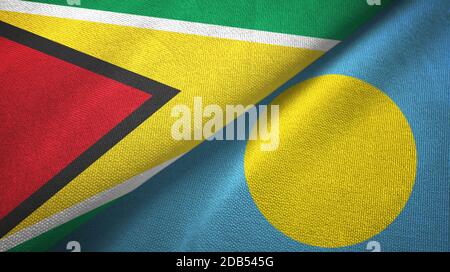 Palau and Guyana two flags textile cloth, fabric texture Stock Photo ...