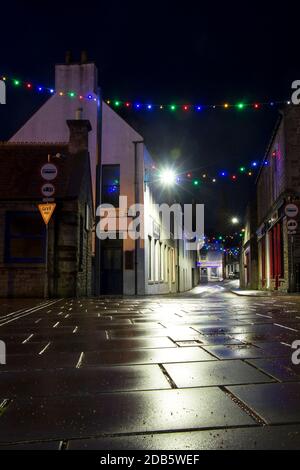 Cheerful street in Stromness on Orkney at night with colorful ...