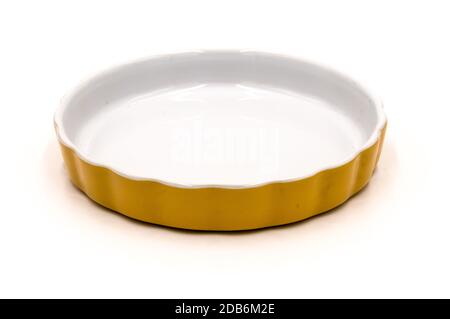 Orange flat porcelain ramekin on a white background Stock Photo - Alamy