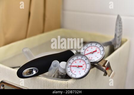 A cheese making kit with thermometers, a pipette and a strainer Stock ...