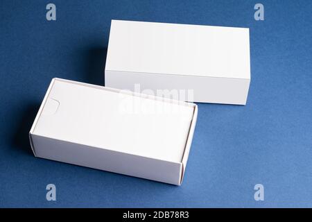 Smartphone's pull out boxes on blue surface, editable mock up template ...